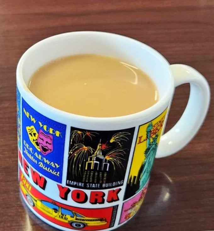 Even the coffee mugs tell stories here—this New York-themed cup holding liquid motivation that keeps the breakfast conversations flowing.
