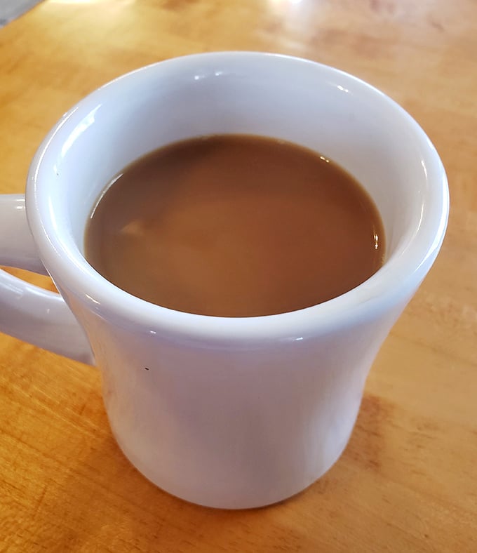 A simple mug of diner coffee—the kind that doesn't need fancy Italian names or artisanal foam designs to get the job done right.