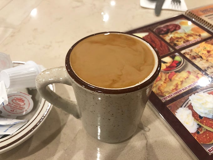 That classic diner coffee mug – sturdy, unpretentious, and promising unlimited refills that'll keep you chatting until closing time.