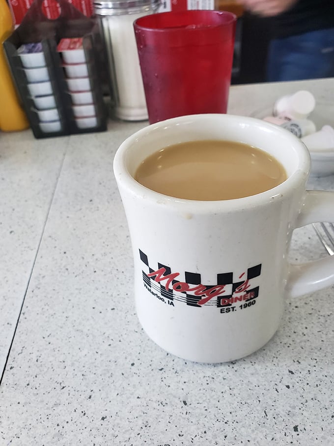 The checkered mug says it all—this isn't fancy coffee with Italian names, it's the honest brew that built America, one refill at a time.