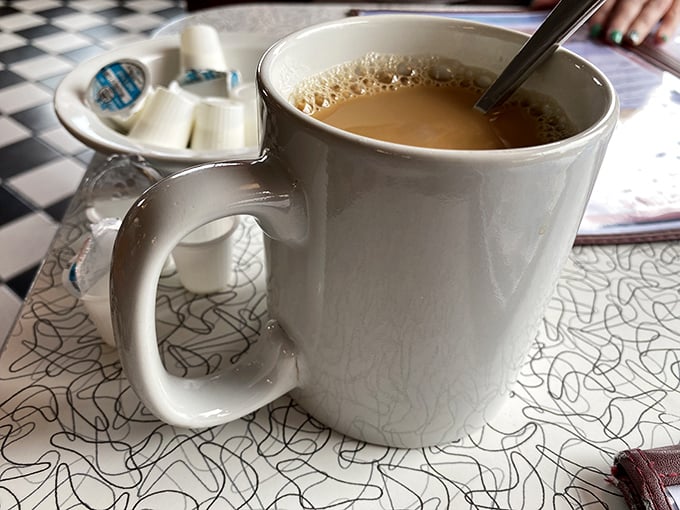 Coffee in a proper diner mug—substantial enough to warm both hands and strong enough to jump-start your day. No fancy foam art needed.