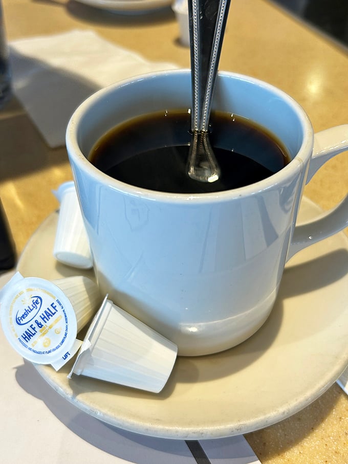 Coffee served in the classic white diner mug—the vessel that has launched a thousand productive mornings and rescued countless Sunday hangovers.