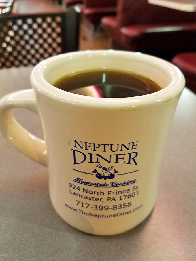That iconic white mug promises bottomless refills of liquid motivation. The Neptune Diner coffee—keeping Lancaster residents functional since day one.