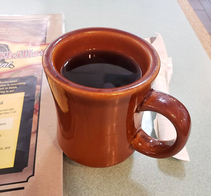 The humble brown coffee mug—civilization's most honest vessel. No fancy latte art needed when the coffee itself deserves the spotlight.