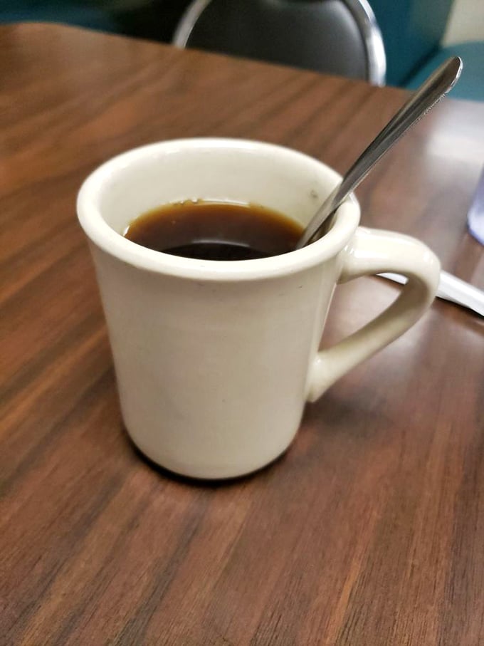 The humble coffee mug—steadfast companion to countless conversations, confessions, and contemplations of ordering that second slice of pie.