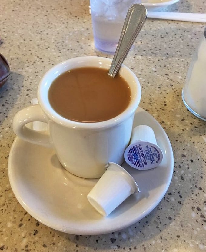 That classic diner coffee – not pretentious, not complicated, just reliable fuel served in the iconic thick white mug that somehow makes it taste better.