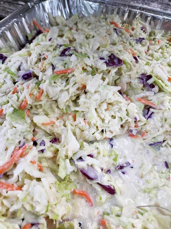 Coleslaw that knows its role—bright, crisp, and ready to cut through rich barbecue with the precision of a palate-cleansing ninja.