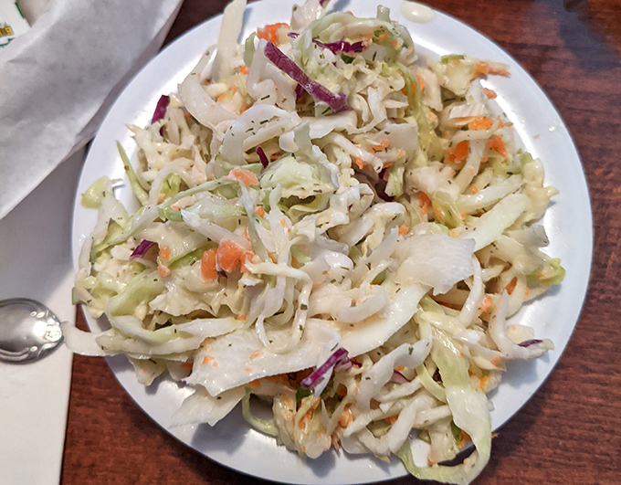 Coleslaw that knows its supporting role—crisp, fresh, and ready to cut through the richness of smoked meat. The unsung hero of any BBQ plate.