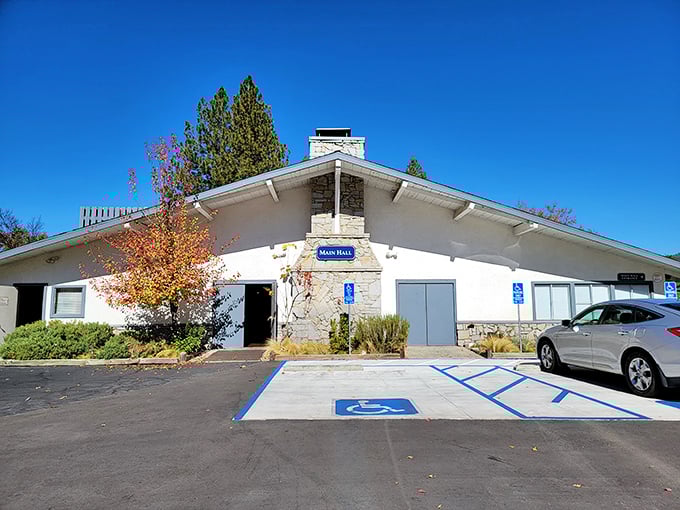 The community center welcomes all with its rustic stone façade – where local debates about pie recipes are taken very seriously.