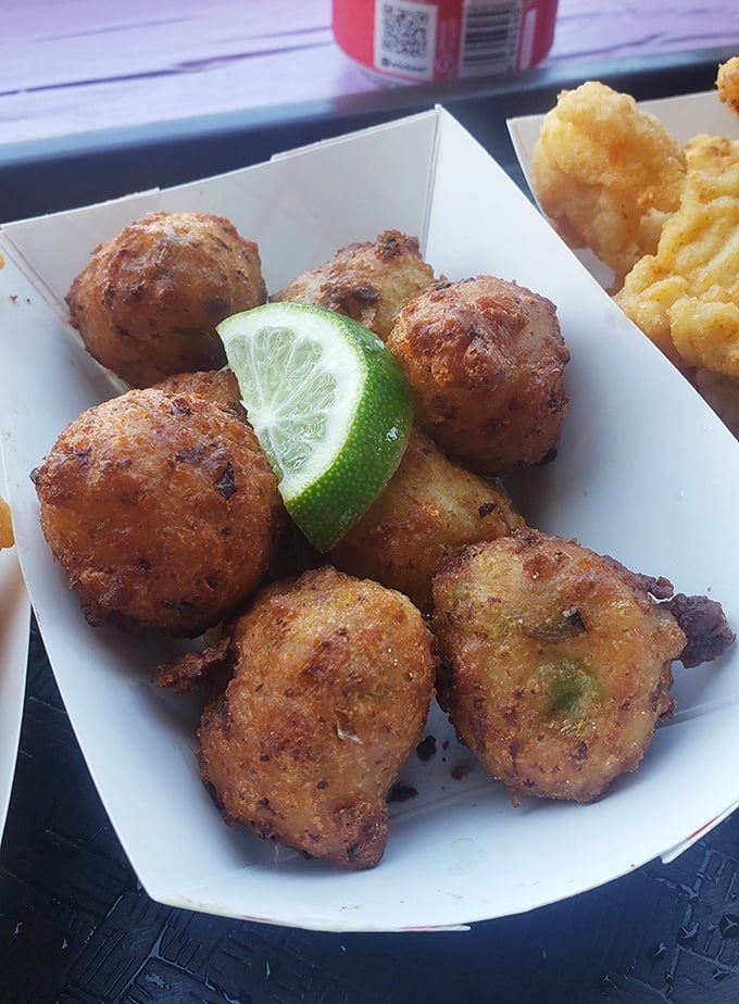 Conch fritters: golden-brown spheres of Caribbean-influenced heaven. That lime wedge isn't just garnish—it's an essential flavor companion.