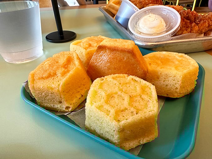 These cornbread muffins aren't just sides—they're the supporting actors who sometimes steal the show from the chicken star.