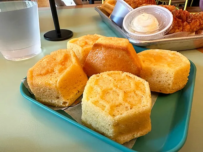 These cornbread muffins aren't just sides—they're the supporting actors who sometimes steal the show from the chicken star.