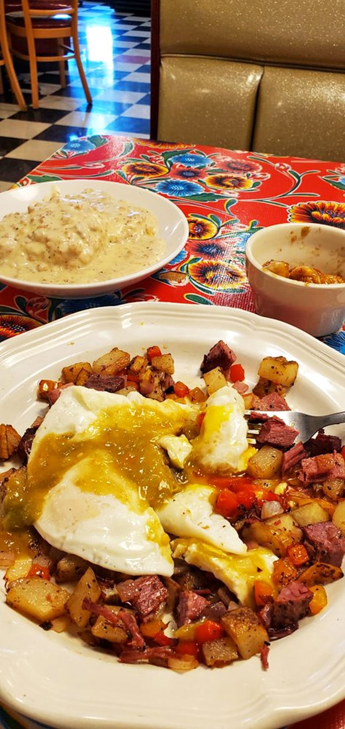 Eggs, potatoes, and corned beef hash—the holy trinity of breakfast, arranged on a plate like edible modern art.