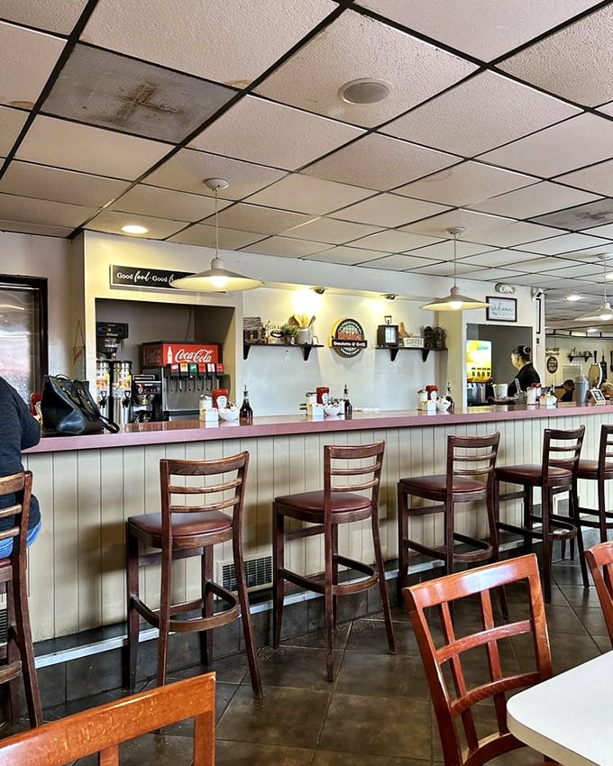 The counter at Nicki's – where solo diners become temporary neighbors and the coffee flows as freely as the conversation.