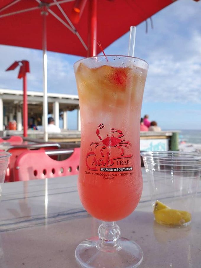 The Crab Trap Punch—a sunset in a glass that makes you wonder if they somehow bottled Florida's famous golden hour.