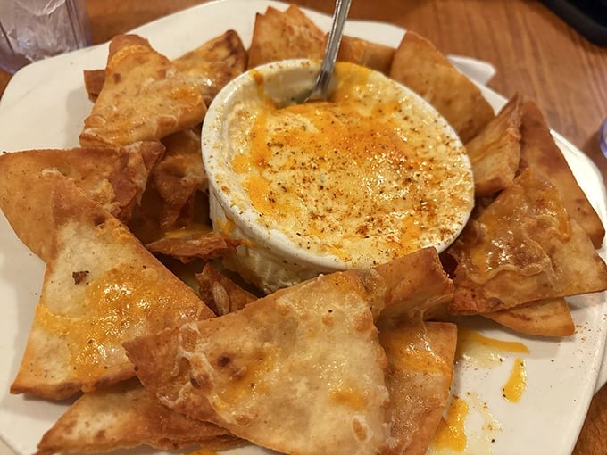 The crab dip with homemade chips—a dish so addictive it should come with a warning label and possibly a support group.