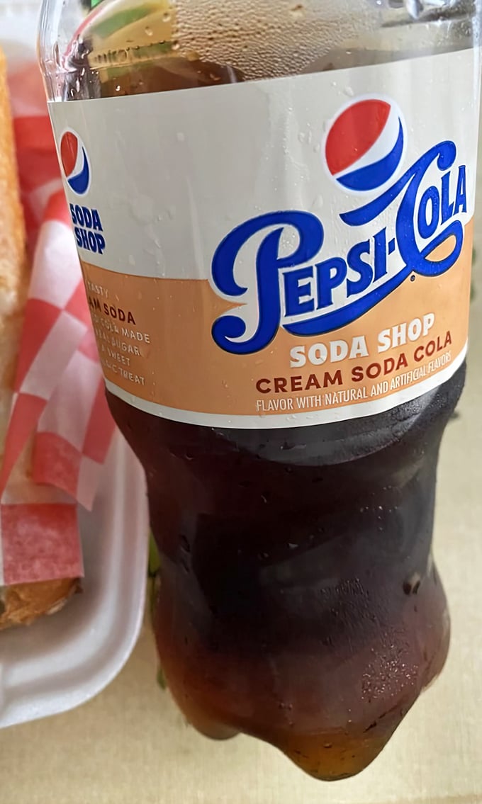 Nothing complements a slice like an ice-cold Pepsi Cream Soda—a throwback beverage choice that feels right at home in this nostalgic pizza haven.