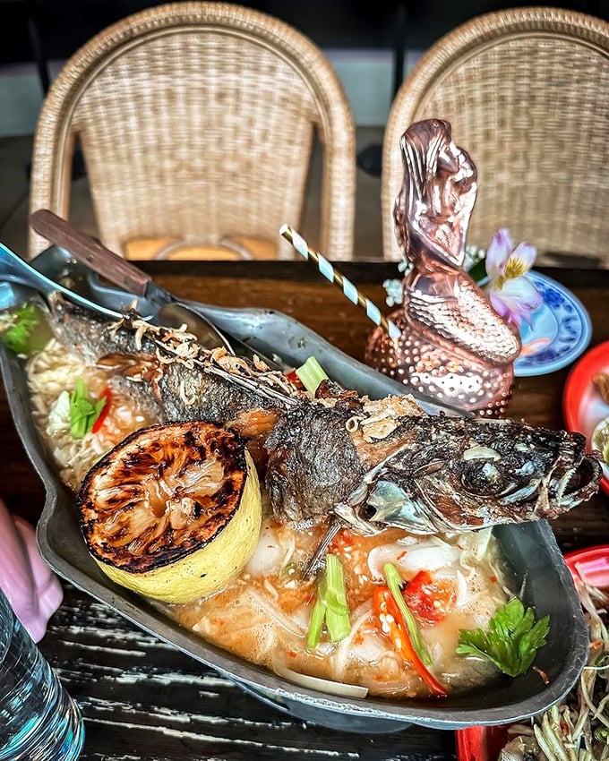 When a whole fish arrives at your table looking like this, you know you're in for a theatrical dining experience that's as much about the spectacle as the flavor.