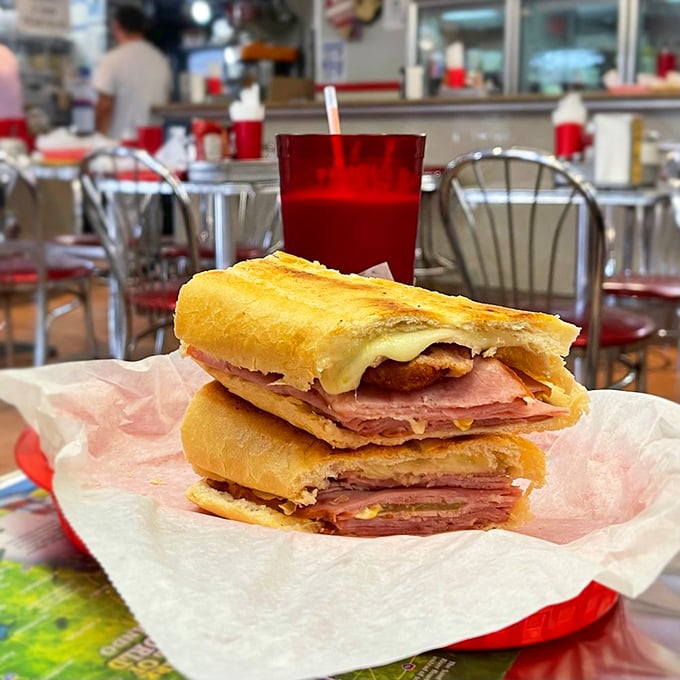 The Cuban sandwich – Miami's edible masterpiece. Layers of ham, roast pork, and cheese pressed until the bread develops that signature crackle that says "eat me now."