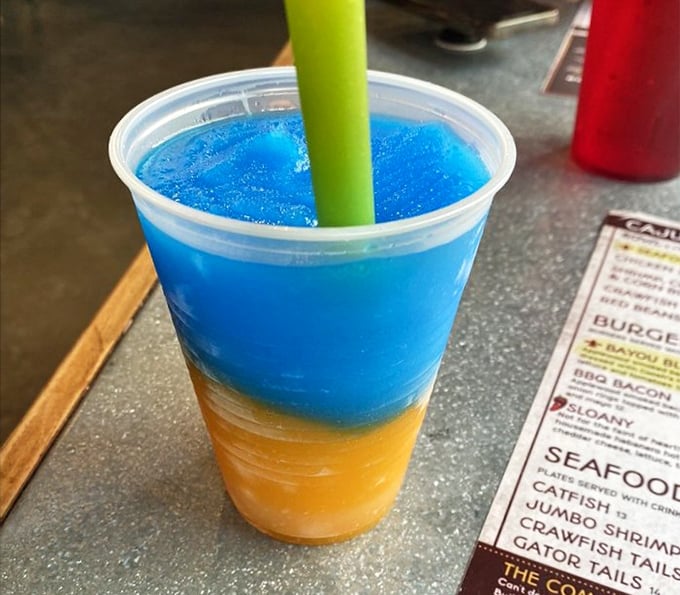 The two-toned daiquiri arrives like a tropical sunset in a cup—the kind of drink that says "vacation" even on a Tuesday afternoon.
