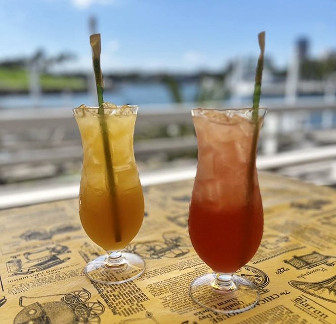 Colorful cocktails with harbor views—because nothing complements Cajun spice quite like something sweet, cold, and potentially regrettable in large quantities.