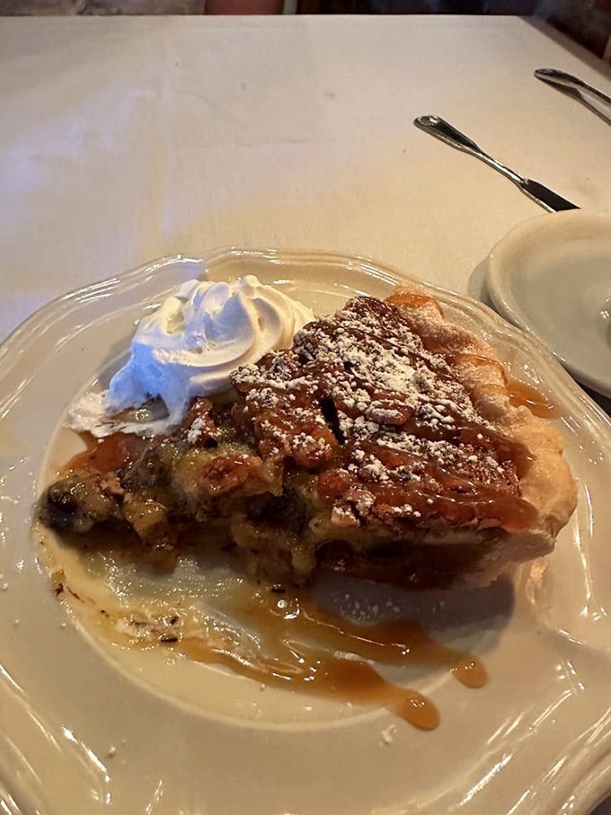 Derby pie with a cloud of whipped cream—because sometimes dessert should wear a fancy hat too.