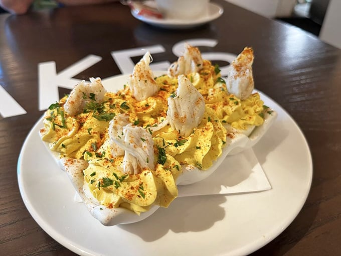 Deviled eggs playing dress-up with lump crab meat—like your grandmother's classic recipe got a fancy coastal makeover and a promotion.