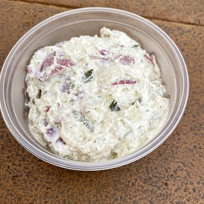 Potato salad with personality—those red onions adding just the right zip. Grandma's recipe might have competition, but don't tell her I said that.