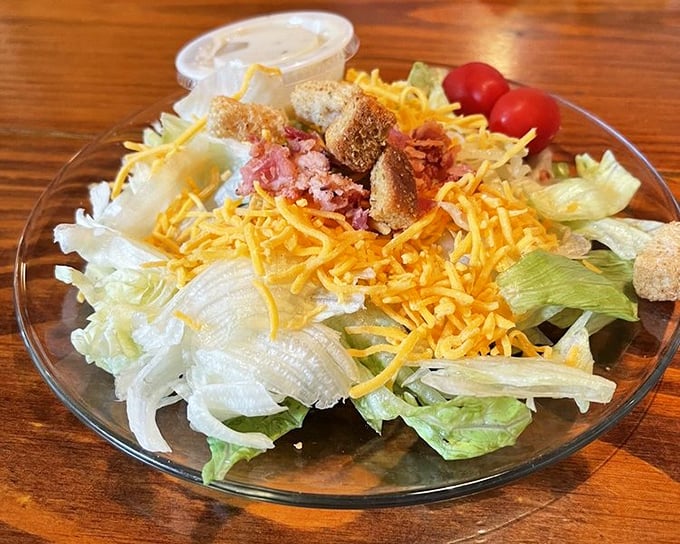 A salad at a steakhouse is like bringing a librarian to a rock concert—surprisingly, it totally works and adds necessary balance.