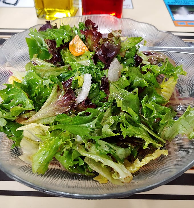 A side salad that proves vegetables can find their place at the diner table—a crisp, fresh counterpoint to heartier fare.