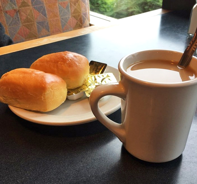 Fresh dinner rolls and coffee—the diner's version of bread and wine, a simple communion that starts every great meal.