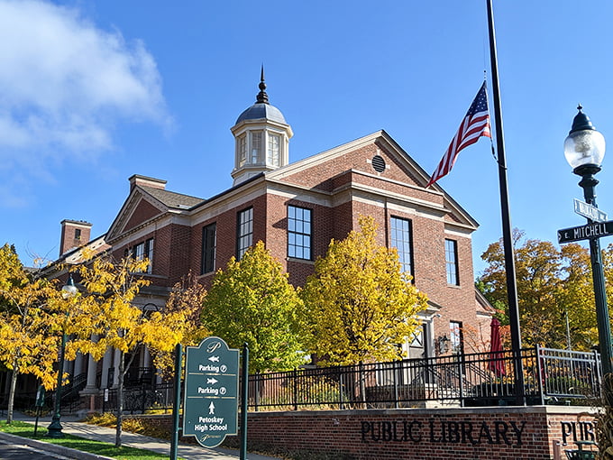 The Petoskey District Library stands proud in autumn splendor, tempting passersby to trade sunshine for stories.