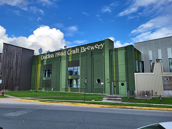 Dogfish Head Brewery's distinctive green facade signals you've arrived at the mothership of craft beer innovation—prepare your taste buds for adventure!