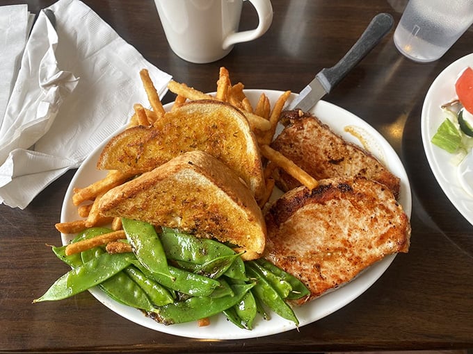 These pork chops aren't just cooked—they're respected. Paired with snap peas that actually snap and toast that's achieved golden greatness.