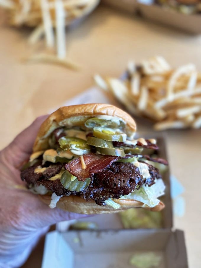 The bacon cheeseburger—proof that sometimes adding one more perfect thing to perfection actually works. The burger equivalent of adding Pacino to a Scorsese film.