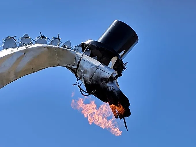 The payoff moment! Genuine flames shoot dramatically from the dragon's mouth, turning skeptics into believers with each fiery burst.