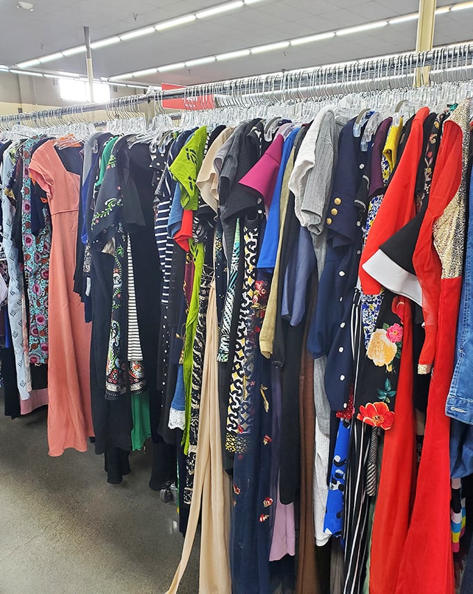 A rainbow of dresses tells a thousand stories—from prom nights to workdays—each hanger holding fashion history ready for revival.