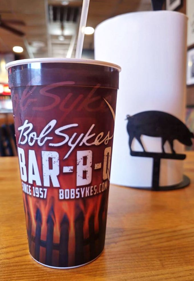 Even the cups bear the mark of BBQ royalty. That pig silhouette is basically Alabama's unofficial state seal.