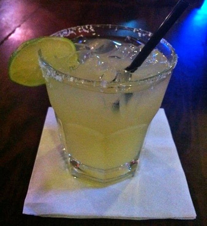 The Horseshoe Margarita—where tequila meets lime in a salt-rimmed glass of possibility. The perfect liquid courage before tackling a 24-ounce porterhouse.