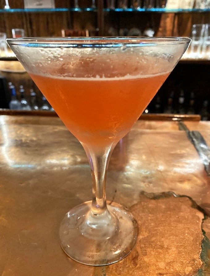 A perfectly crafted cocktail with just the right blush—like a sunset over the Atlantic that you can actually drink.
