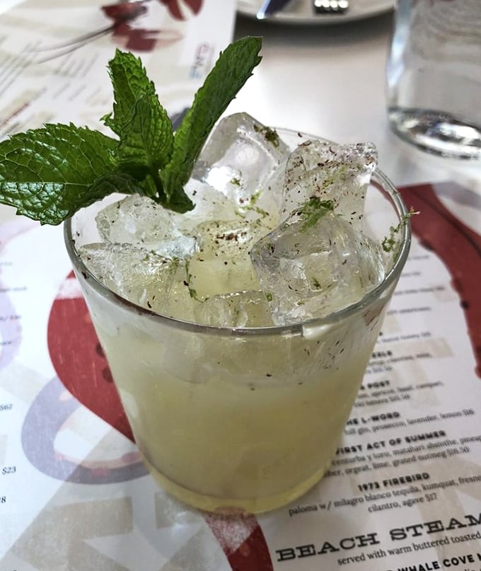 A cocktail that looks like summer in a glass. That sprig of mint isn't just garnish—it's an aromatic invitation to your first refreshing sip.