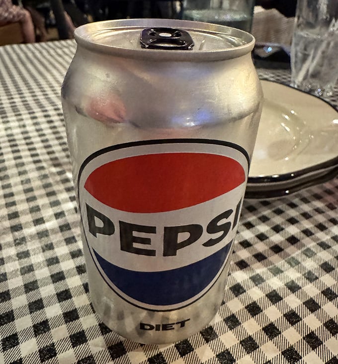 Even the Diet Pepsi looks photogenic against those classic checkered tablecloths. Sometimes the simple pleasures complete the experience.
