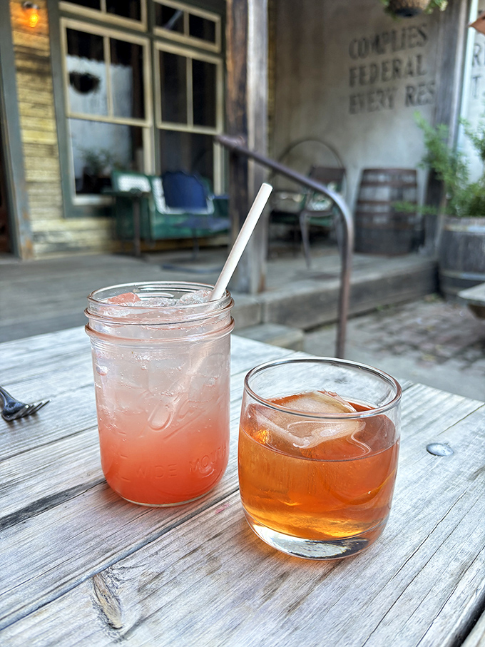 Cocktails and conversation on the patio—because nothing washes down smoked meat quite like something equally crafted with care.