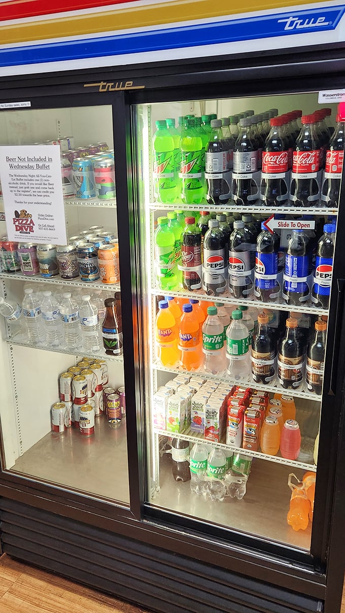 A well-stocked beverage case is the unsung hero of any pizza experience – cold drinks ready to tame the fire of hot slices.