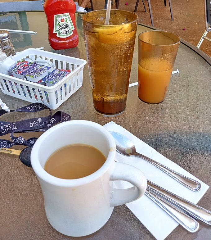 Morning beverages arrive in proper diner style – coffee hot, juice fresh, and refills automatic.