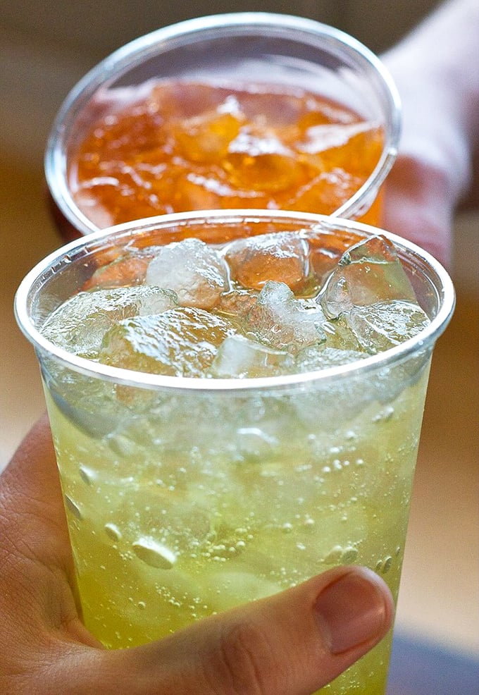 Cool, refreshing beverages standing by, ready to rescue brave souls who ventured too far into "Xtra Hot" territory. Liquid mercy in a cup.