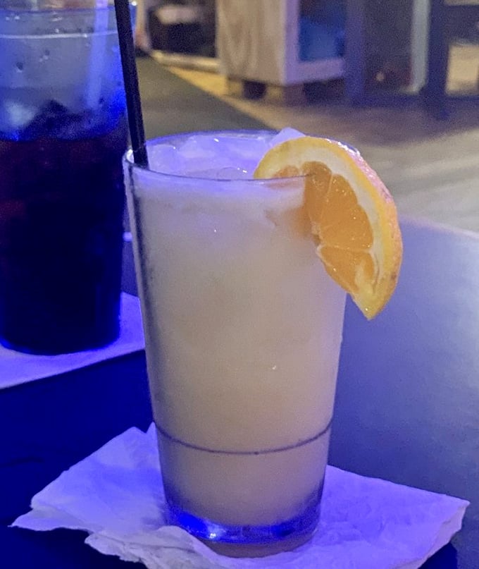 A frosty drink with a lemon wedge—because nothing complements Gulf seafood like a cold beverage on a warm Florida afternoon.