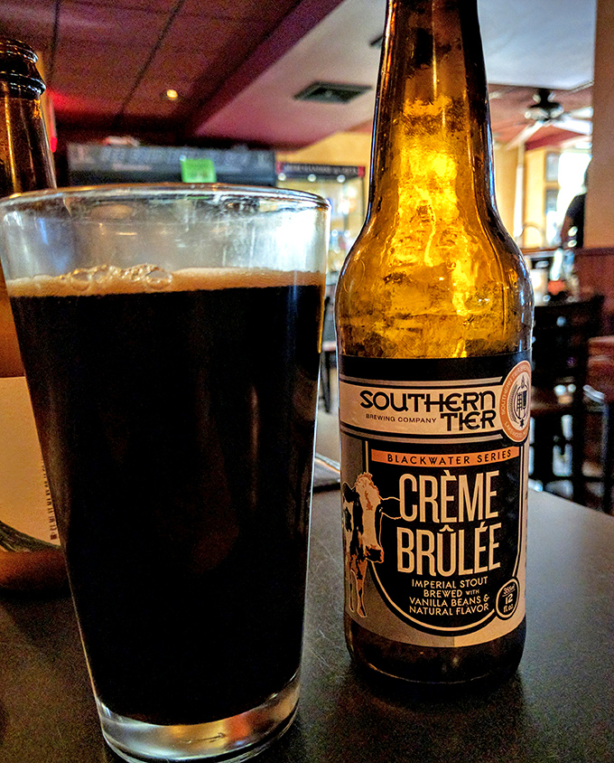A proper pint of stout alongside Southern Tier's Crème Brûlée beer—proof that Pennsylvania knows good beer isn't just a beverage; it's a companion.