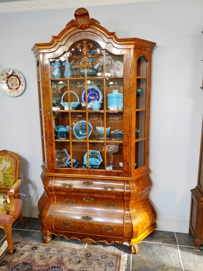 This Dutch Chippendale-style cabinet didn't just survive decades—it thrived, its burled wood and curved glass more beautiful now than the day it was crafted.