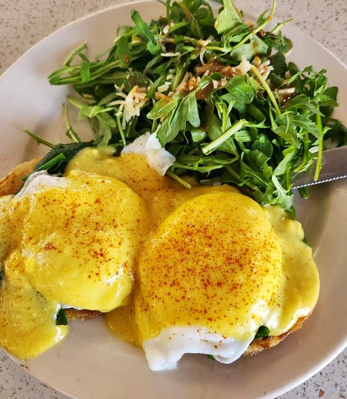 Eggs Florentine with a side of arugula – because sometimes you need something green to justify the hollandaise sauce party.